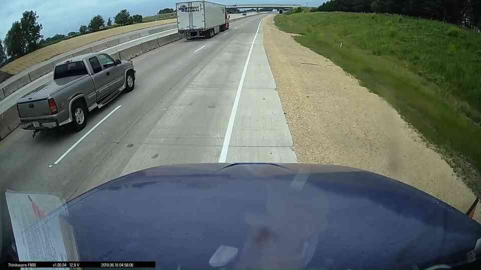 Woman bails out of police car's back seat