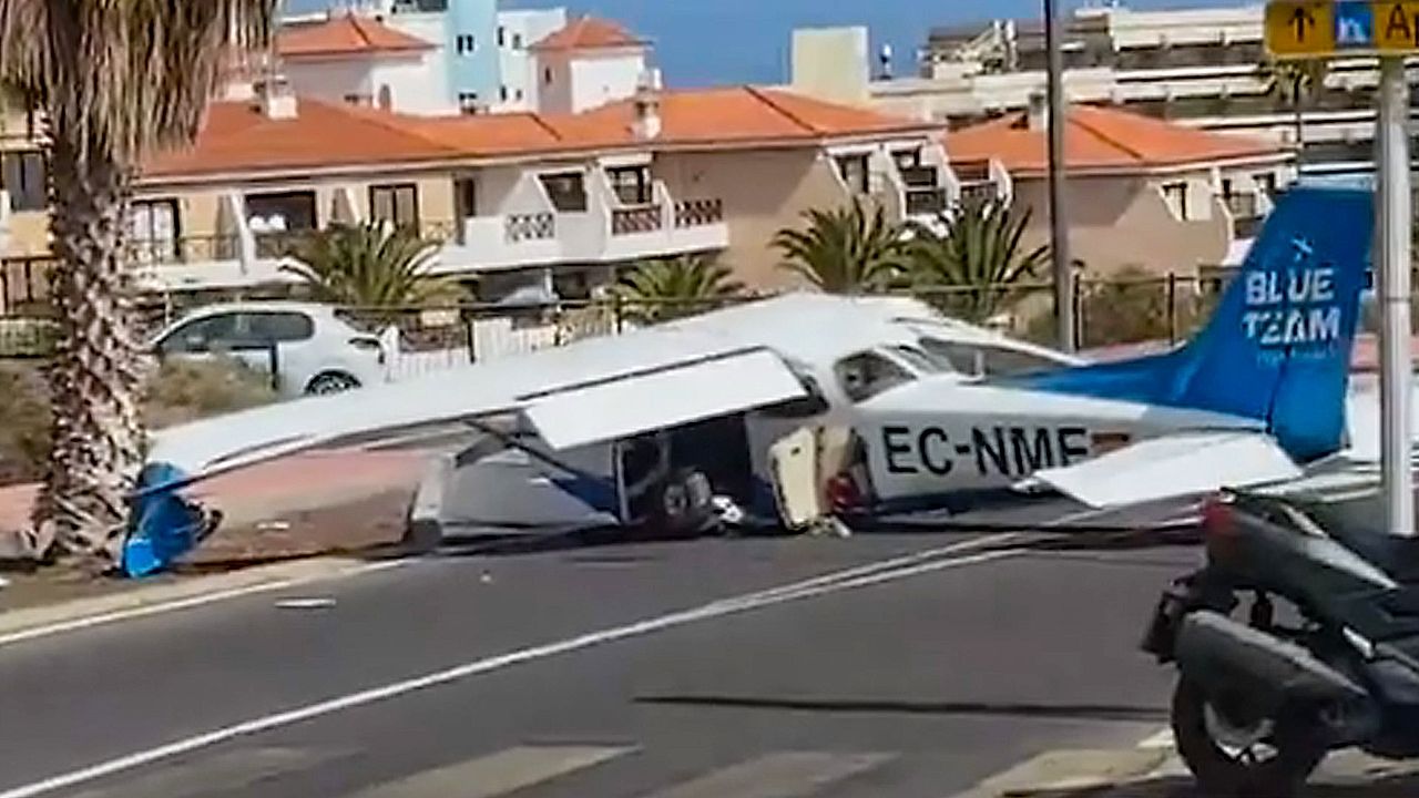 Small plane crash-lands on busy road on Tenerife as tourists flee in panic
