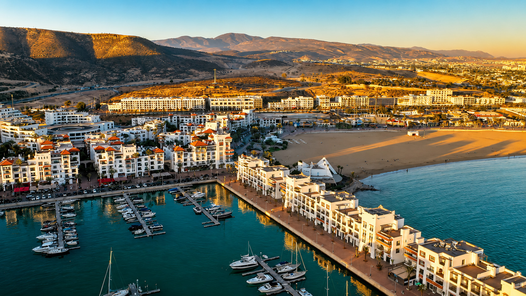 Agadir’s Atlantic coastline glowing under the sunset