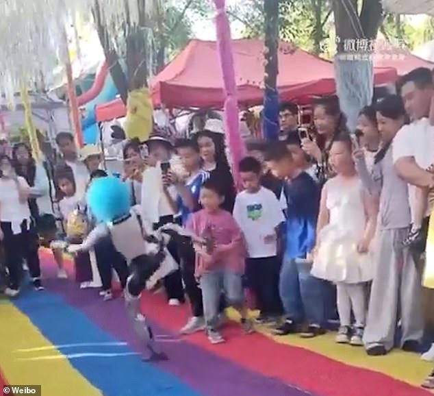 Out-of-control robot karate kicks a child in the stomach while ...
