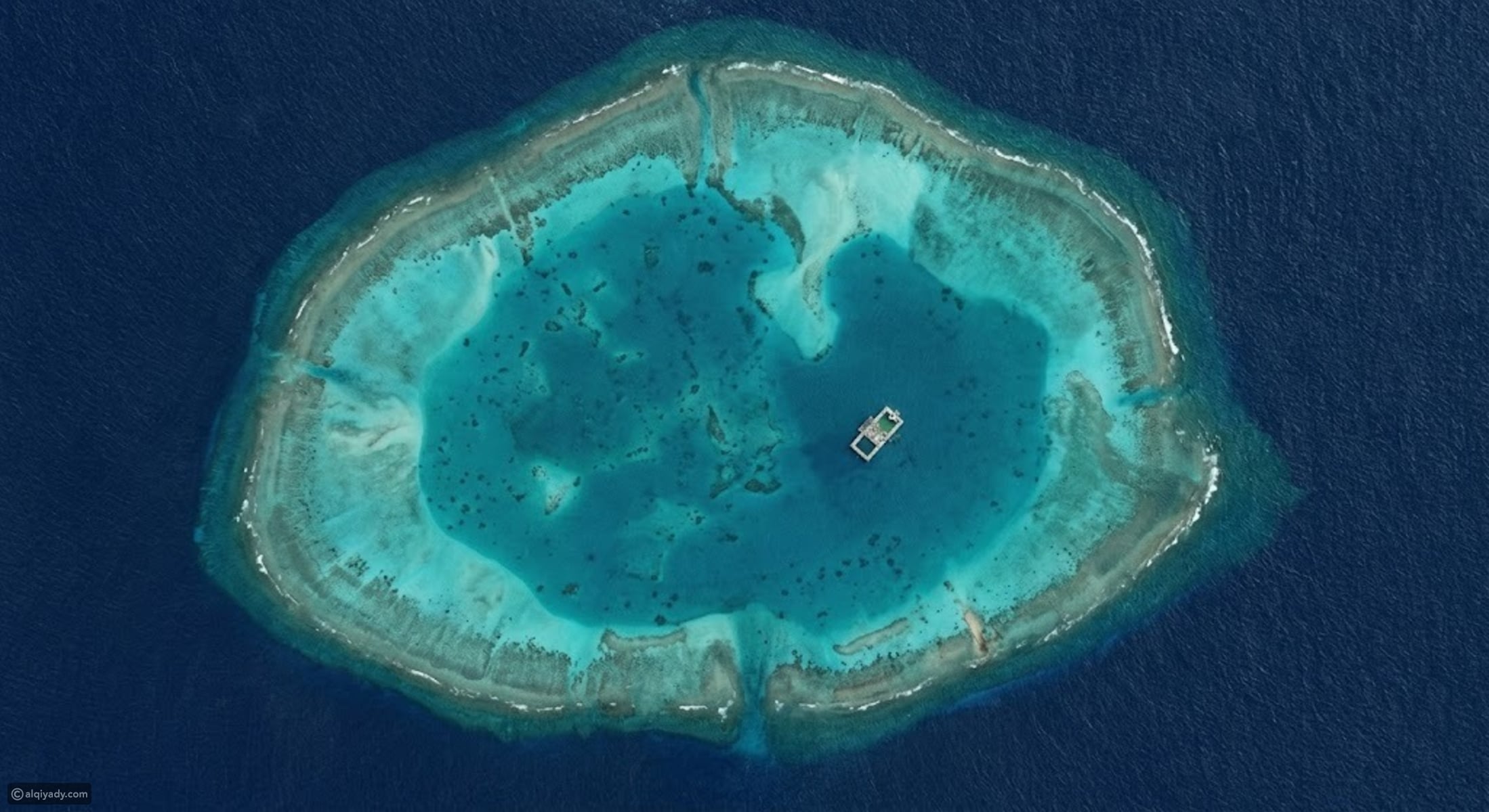 Satellite images show suspected structure at disputed South China Sea atoll