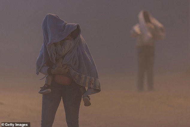 Americans in three states told to close windows now as lung-penetrating ...