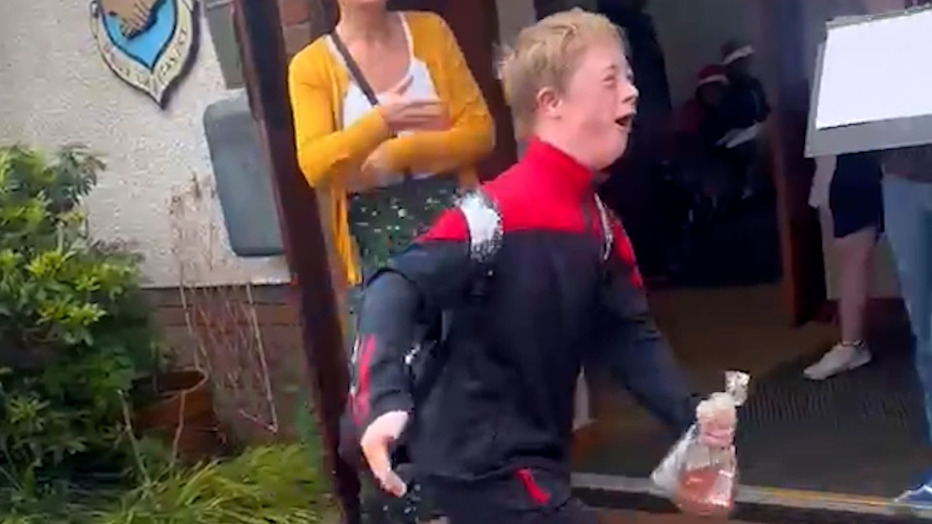 Moment boy bursts into tears during surprise reunion with uncle