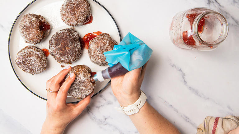 These jam-packed strawberry donuts get an extra flavor boost with a ...