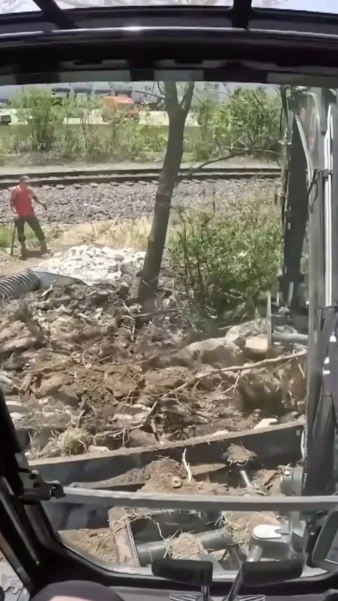 Cleaning concrete with a skid loader