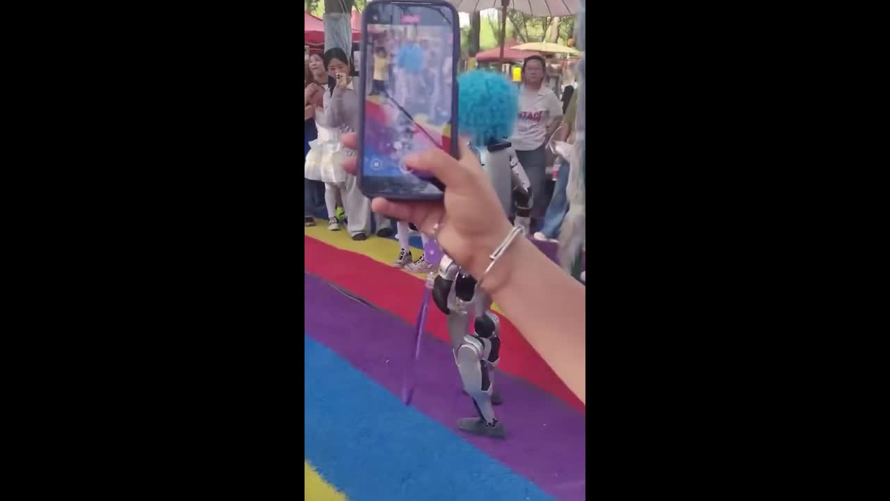 Robot demo goes wrong as young boy is kicked during martial arts display