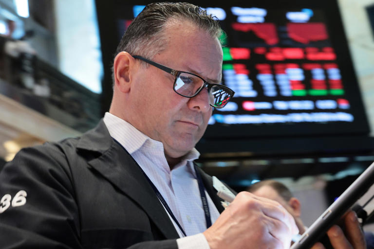 Wall Street tumbles after strong jobs report