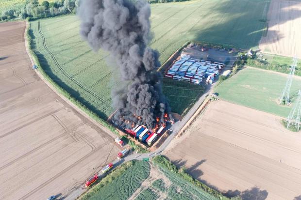 Twelve double decker buses ablaze at South Essex storage yard