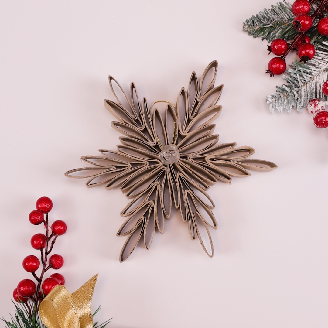 Craft a stunning snowflake from cardboard rolls ️