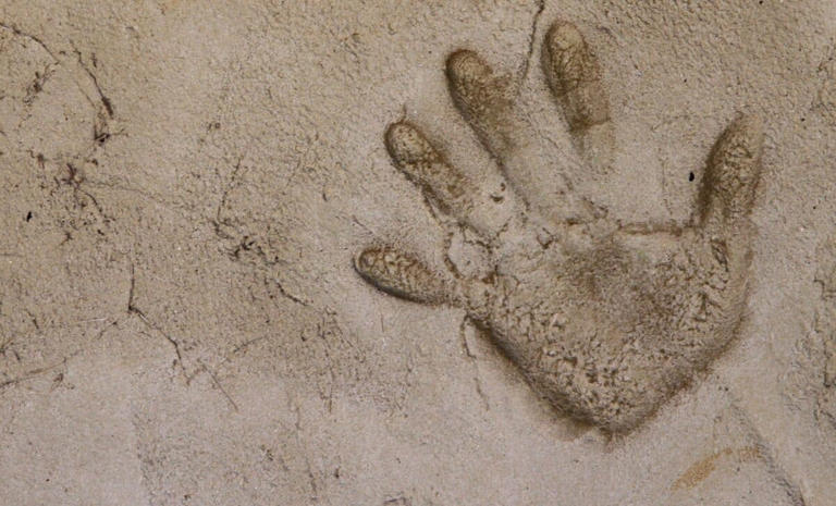 Archaeologists found a complete 4,000-year-old handprint hidden beneath ...