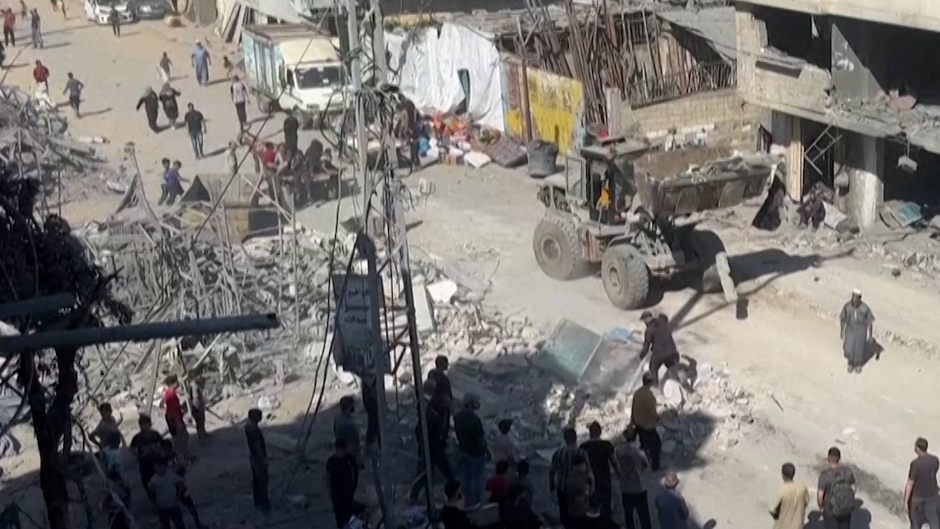 Families clear rubble after overnight Israeli strikes in Gaza