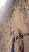 Cyclist nearly plunges into ravine