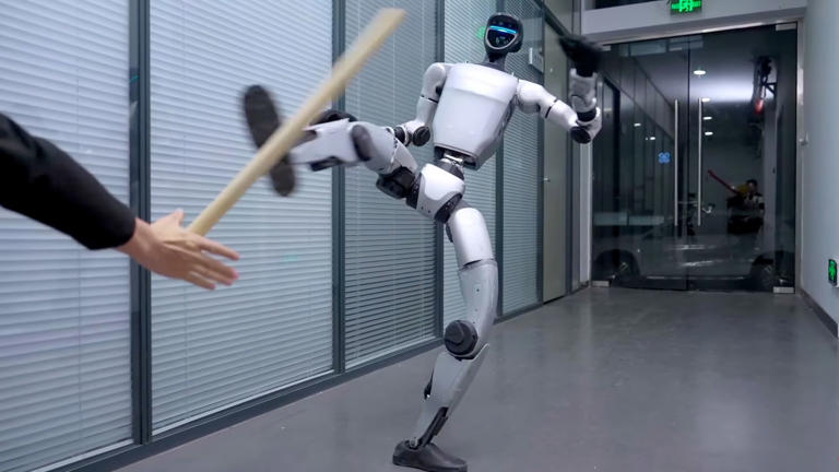 Robot kicks child in stomach during demo in China