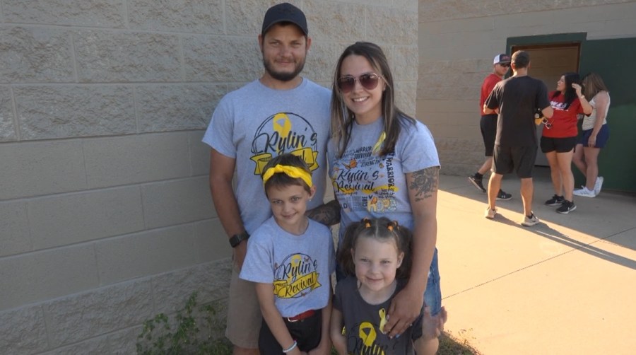 Courageous young girl battling cancer throws out the first pitch