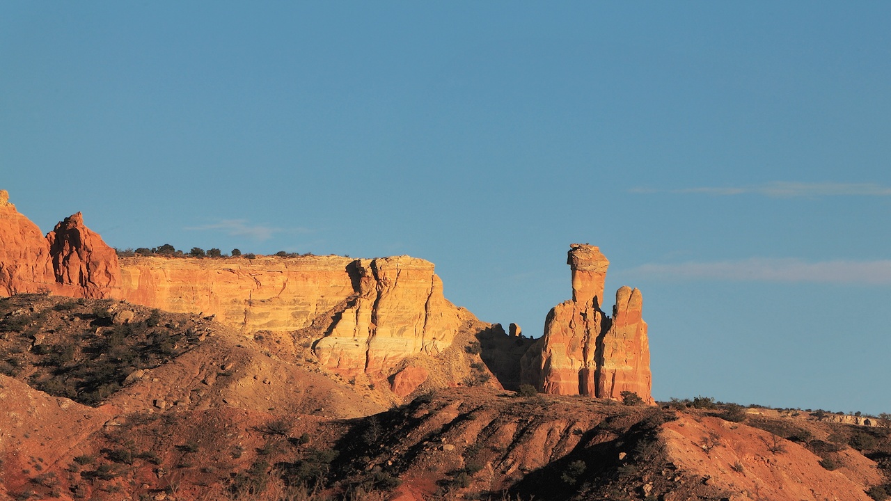 An hour from Santa Fe, red and white cliffs stack 130 million years ...