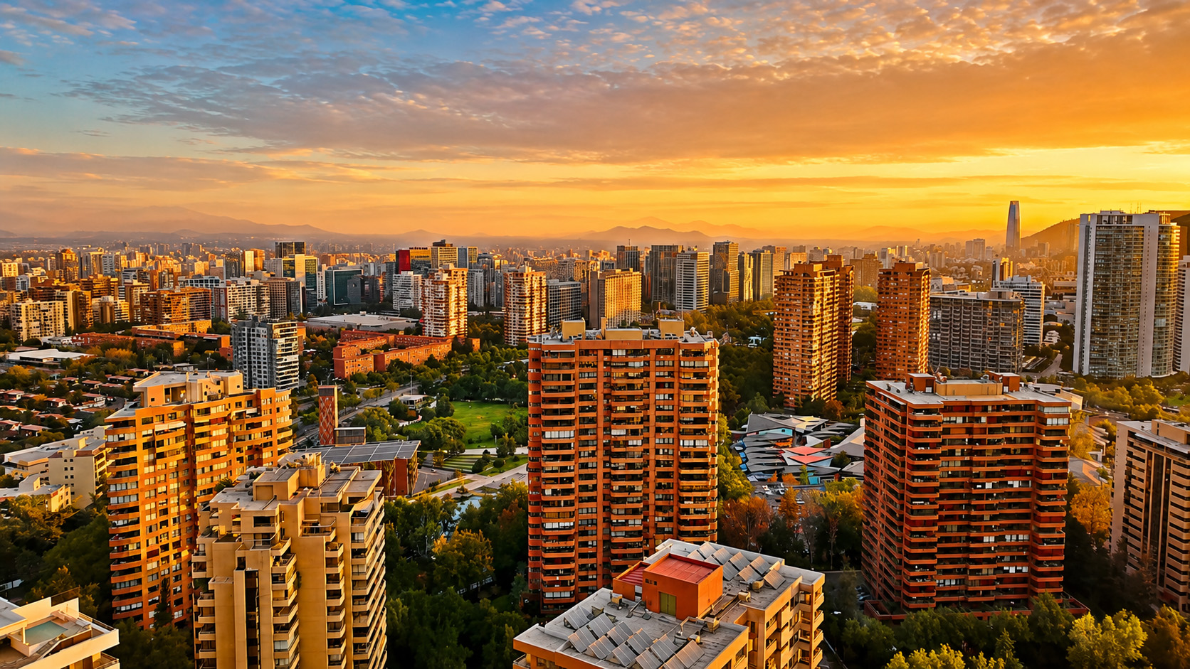 Glass towers glowing above the city as the sun sets
