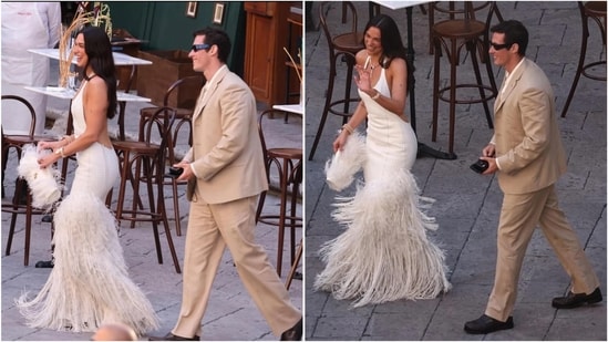 Dua Lipa brings modern bridal glam in backless feather-trim ivory dress ...