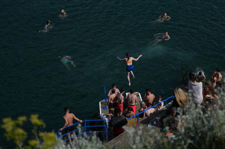 Urgent warning issued over popular sea swimming spot as people 'climb ...