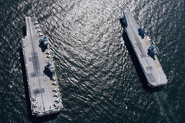 Royal Navy's flagship aircraft carrier left 'marooned' after breaking ...