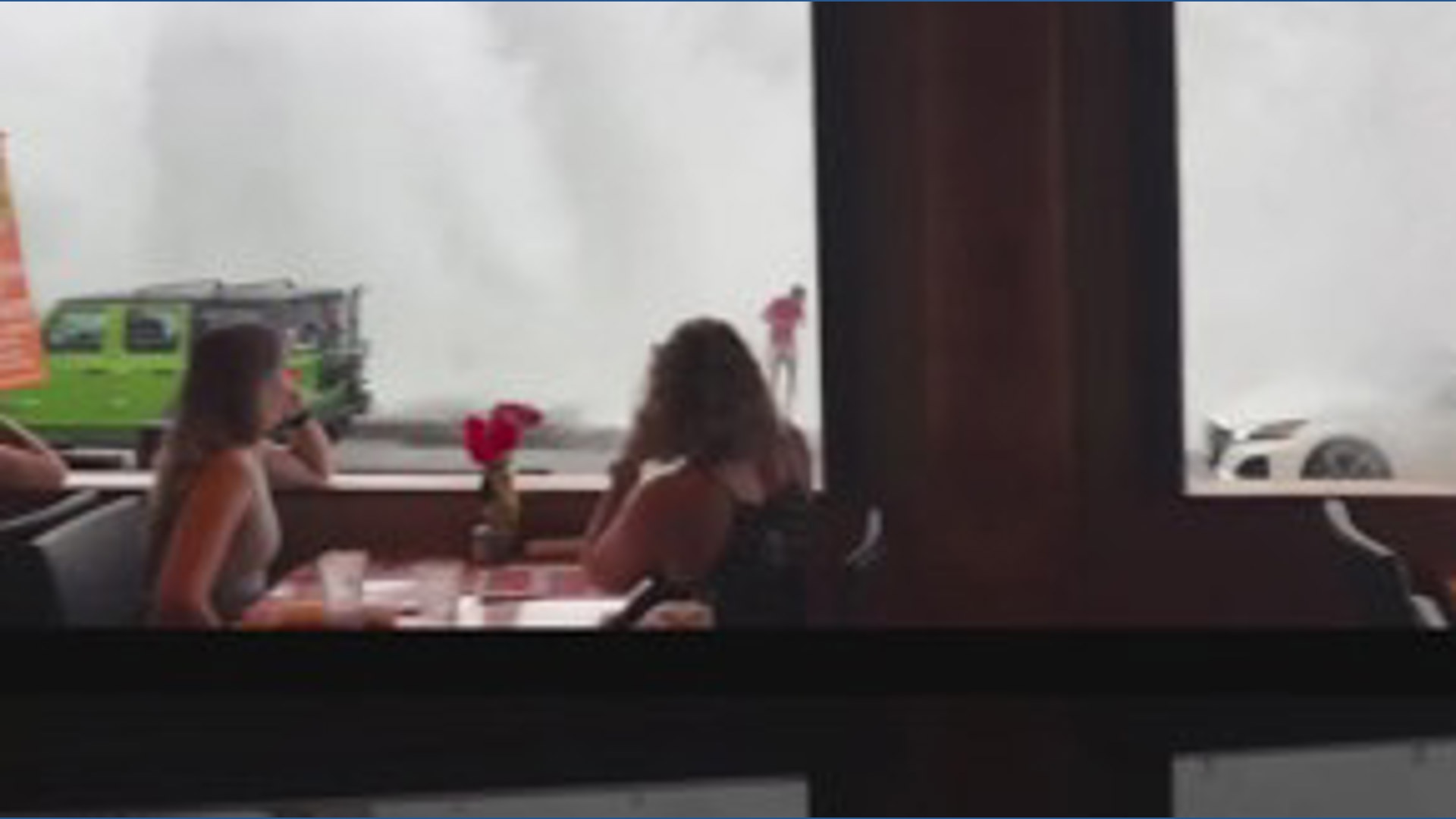 Huge waves crash against breakwater near Hawaii restaurant