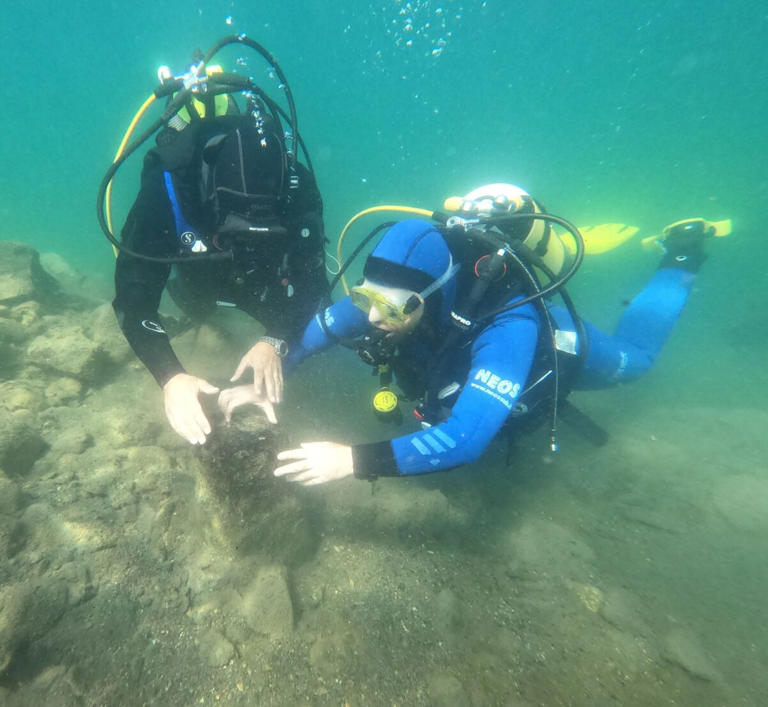 Divers pulled a tiny figurine from an Italian lake after 3,000 years ...