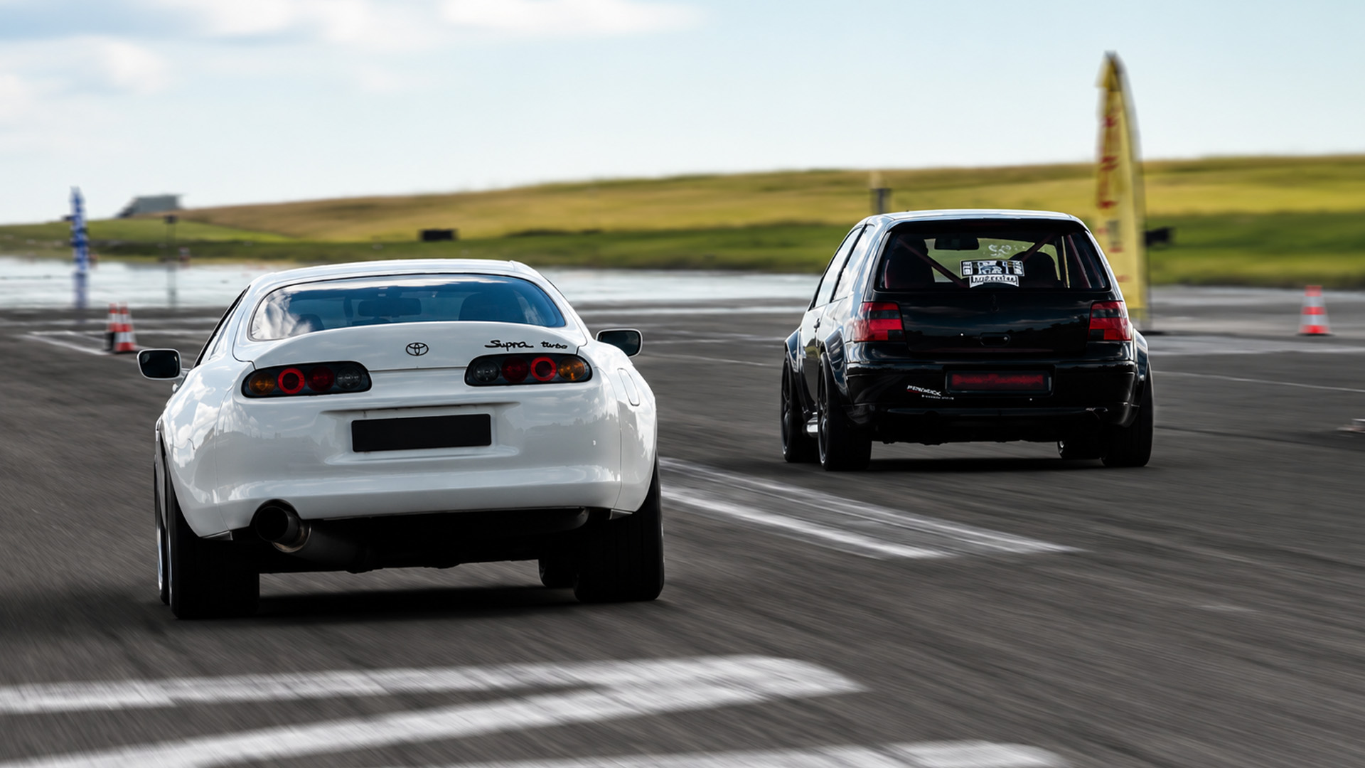 Modified VW Golf challenges Toyota Supra in drag race