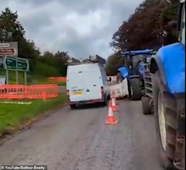 Moment van ploughs through construction works in road rage incident