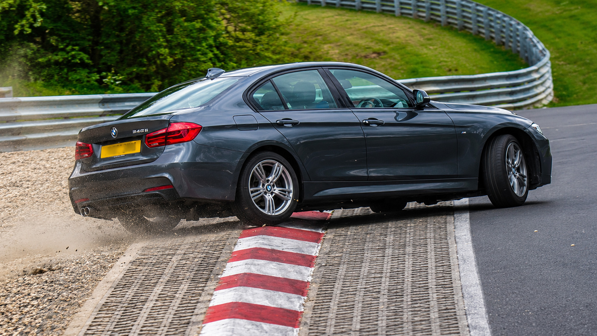 Close call as BMW 340i runs wide on track