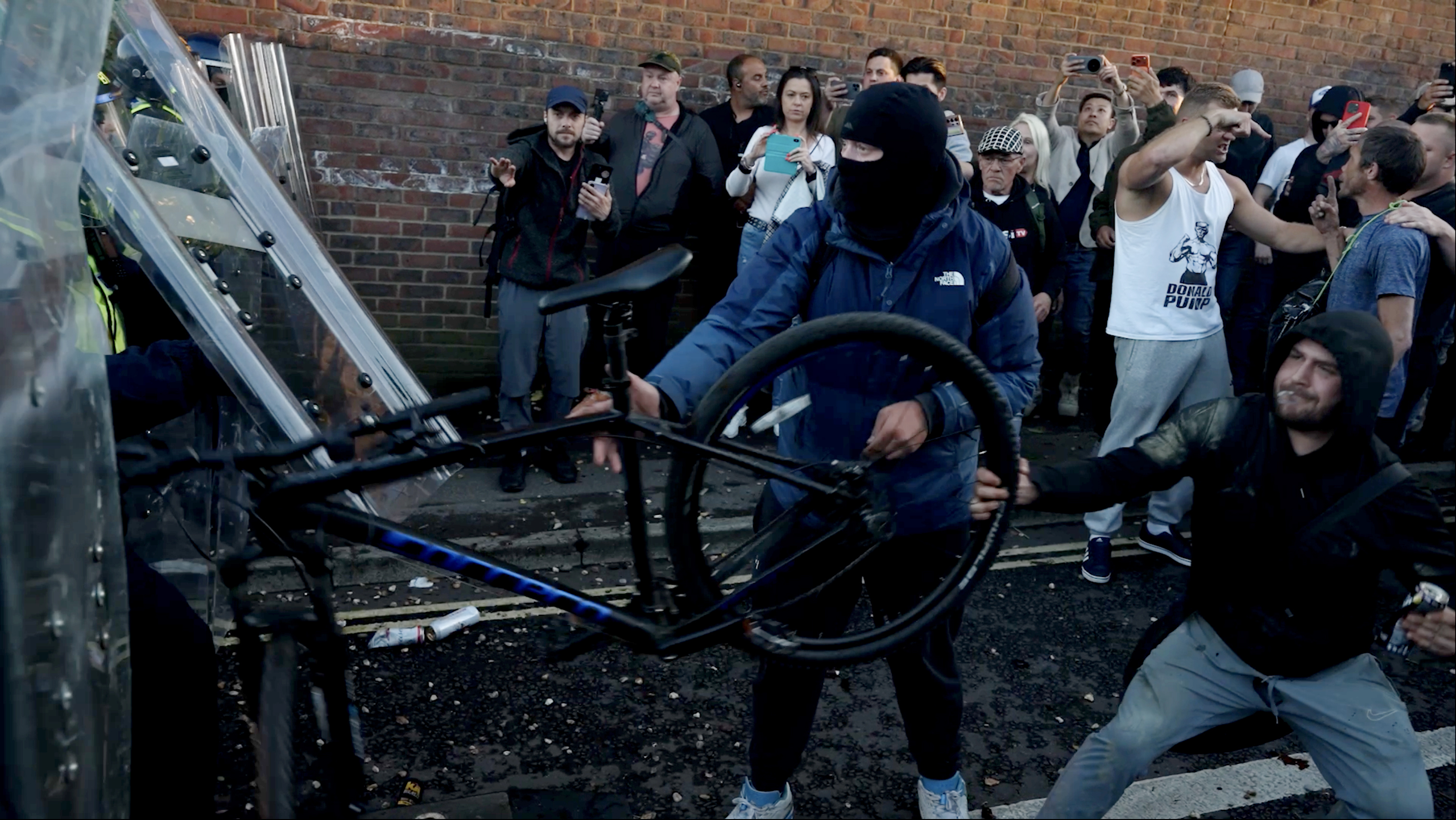 Two men jailed for violent disorder at mob protest following death of ...
