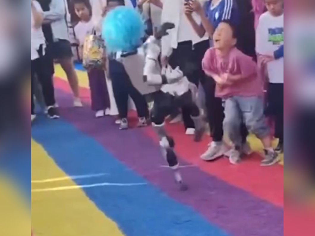 Clown robot kicks a child in the stomach