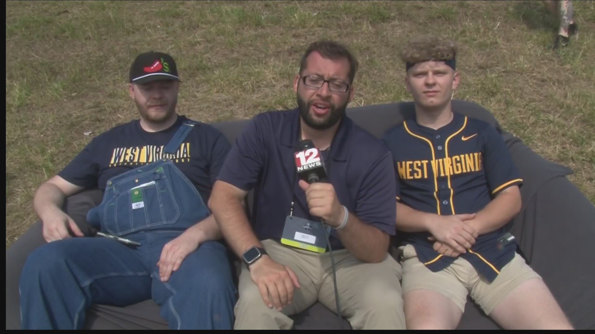 Watch: John Lowe interviews WVU fans watching baseball game from couch ...