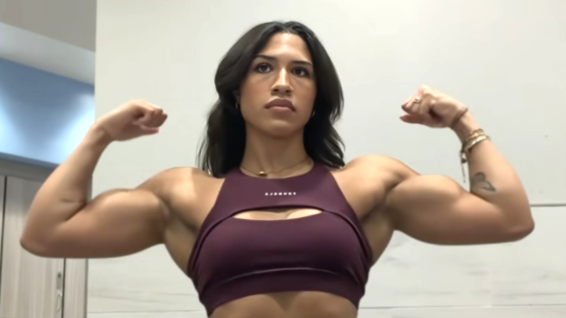 Deemed "too muscular for a woman," she proudly displays her athletic figure