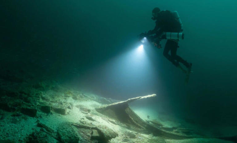 Divers pulled a tiny figurine from an Italian lake after 3,000 years ...