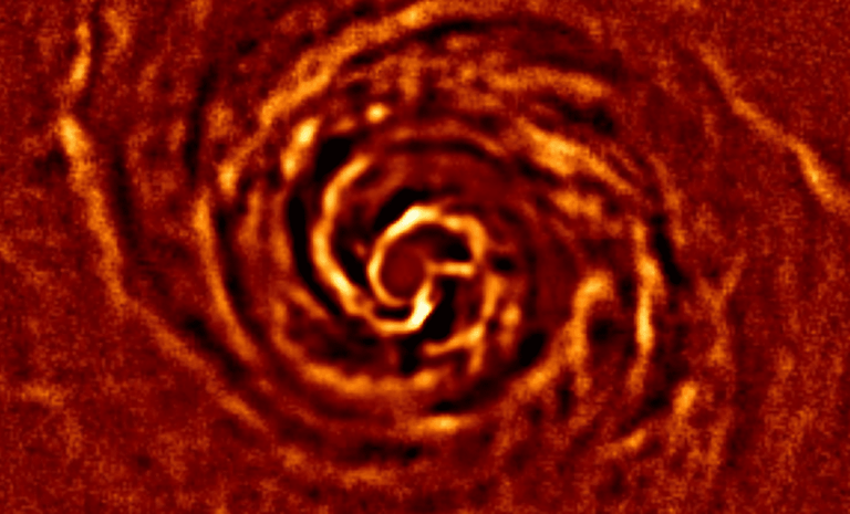 Astronomers capture first live spin of nearby planet-forming disk