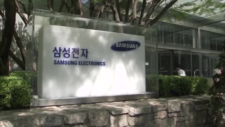 Samsung workers approve pay deal, shares surge