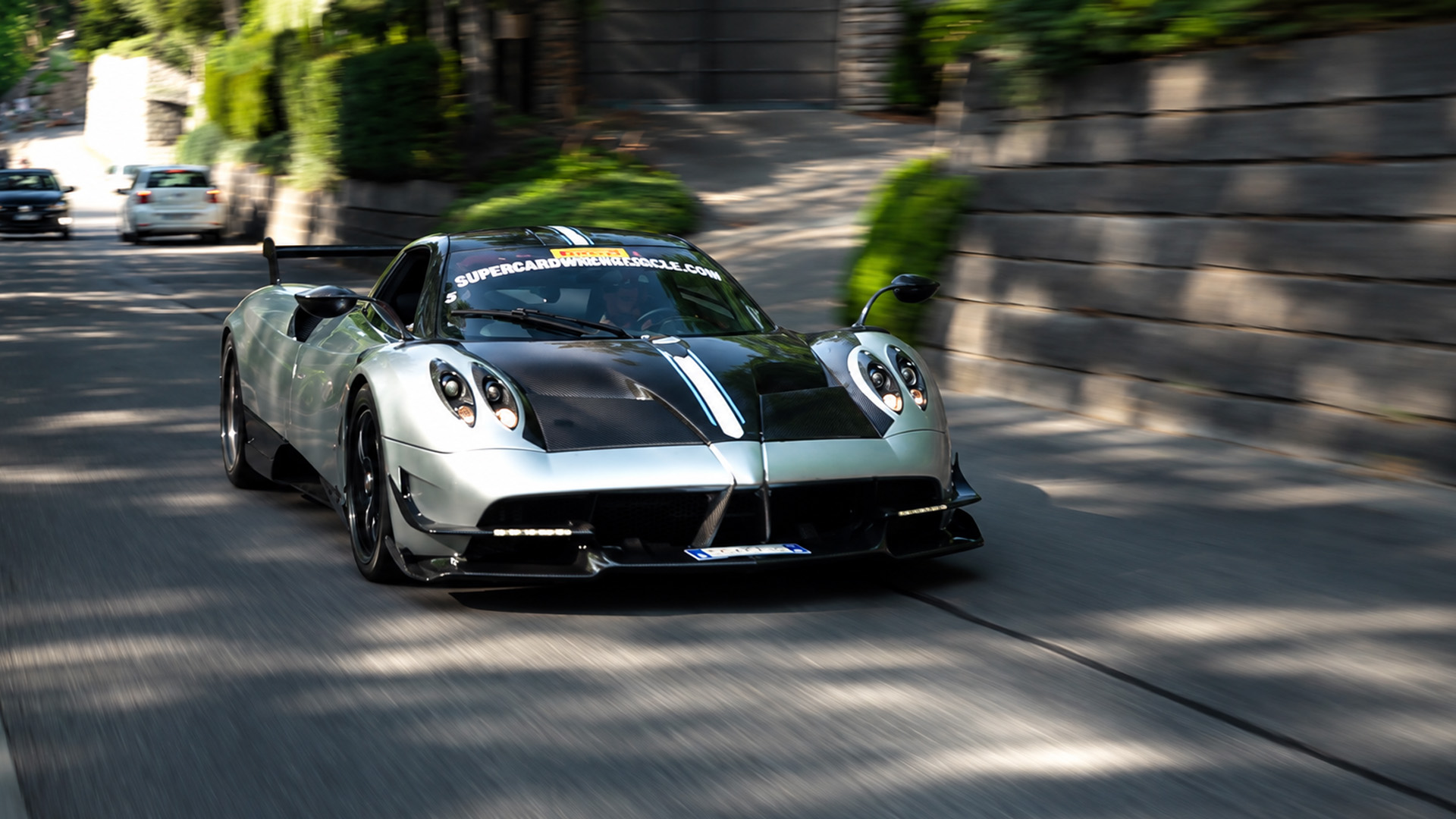 A Pagani Huayra storms through a quiet road