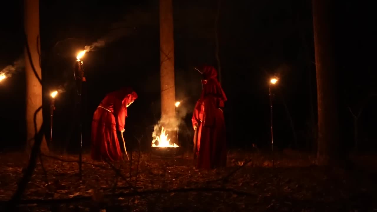 Masked group caught performing a strange ritual in the woods