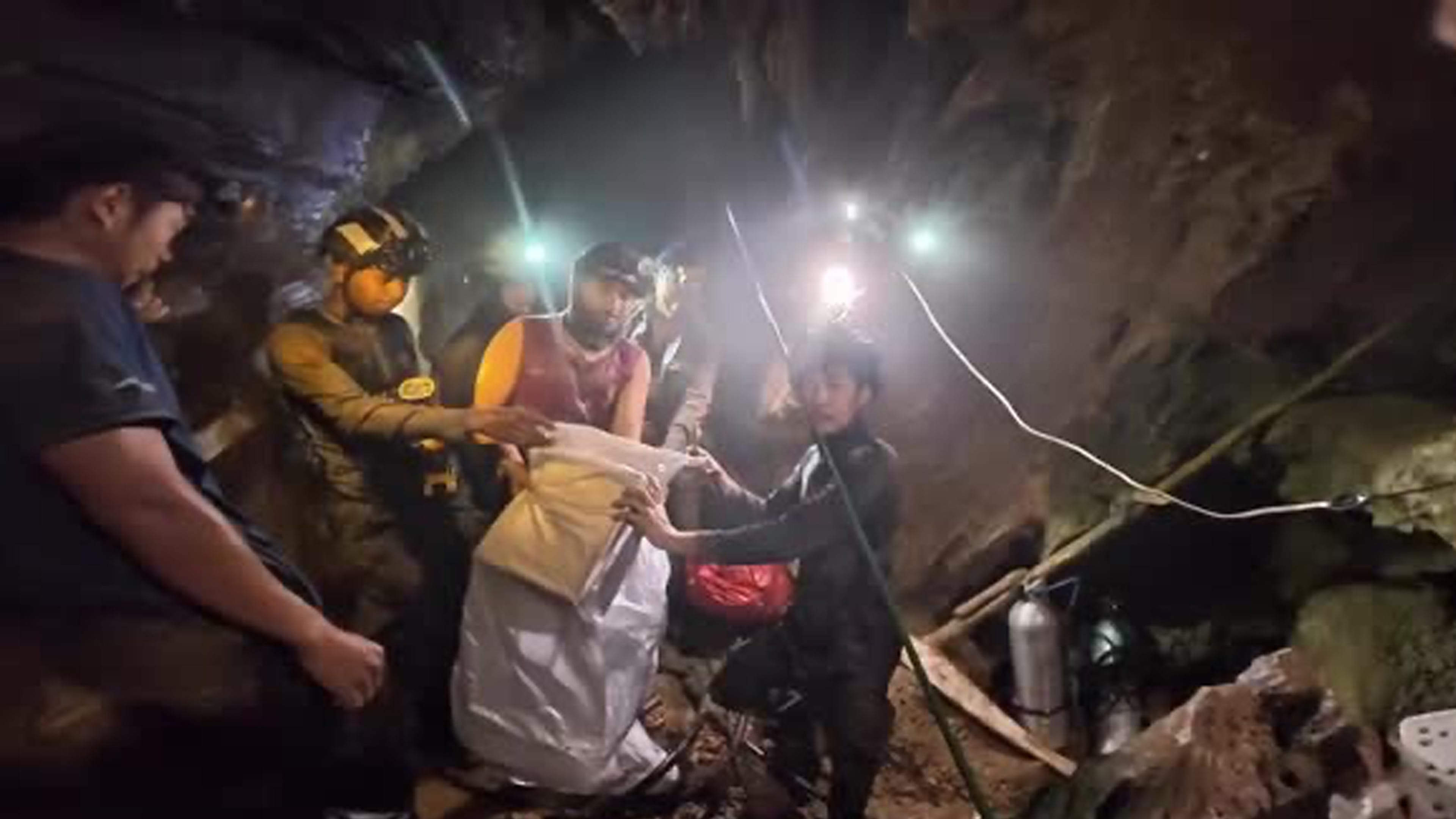 Search continues in flooded Laos cave as rescuers push through ...
