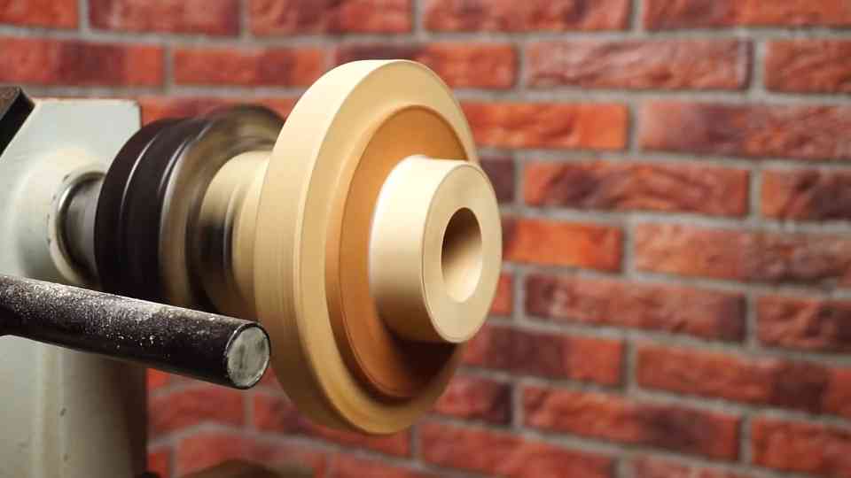 Watch how random wood blanks turn into a wall lamp