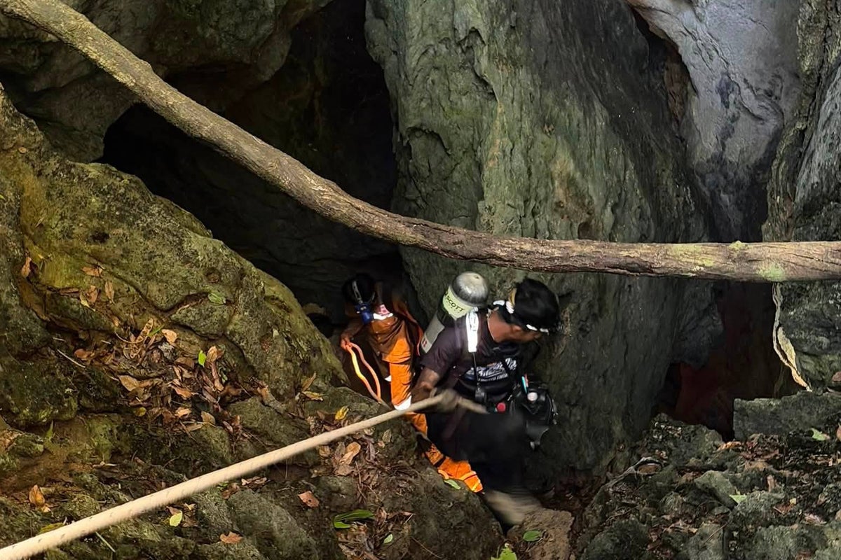 Five of seven people trapped in flooded Laos cave found alive