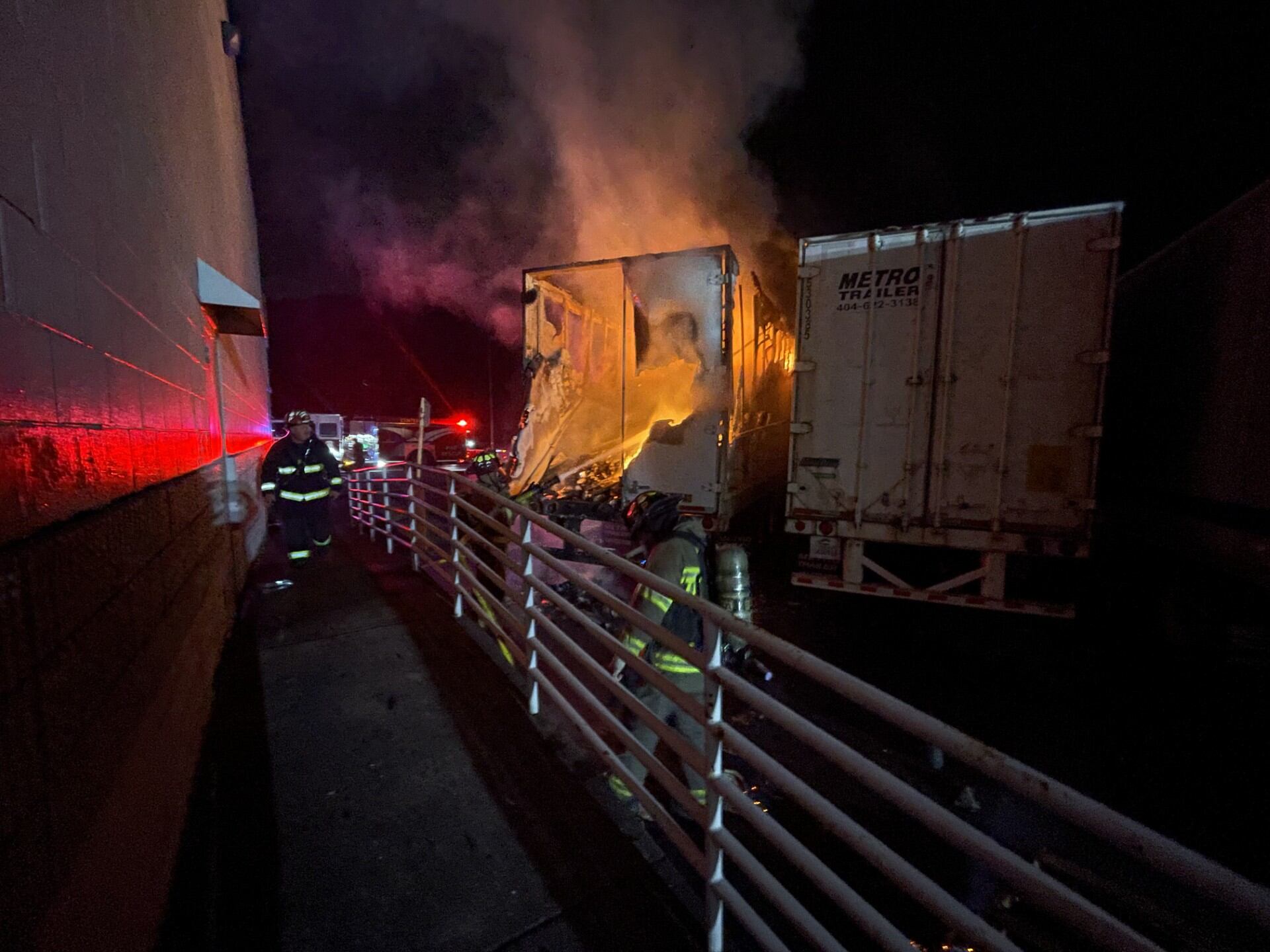 Fire damages 18-wheeler storage trailers outside Love Lady Thrift Store