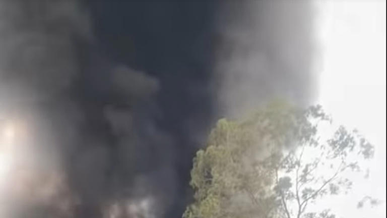 Horror moment tyre shop engulfed in flames