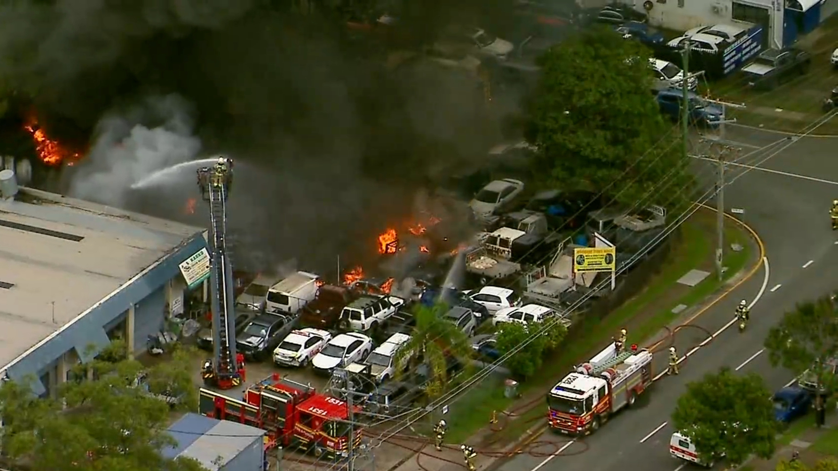 Fire destroys 20 cars, puts suburb into lockdown