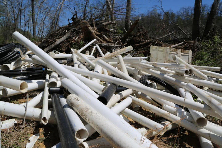 Asheville group urges owner to clean up PVC pipe in French Broad River