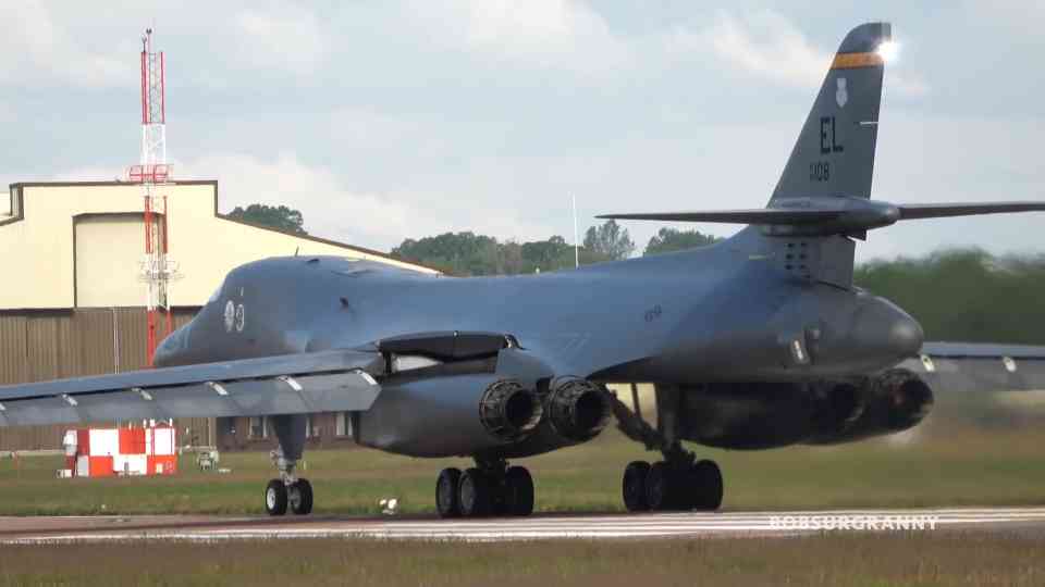 Watch the B-1 drop in hard - then the B-52 pops its chute