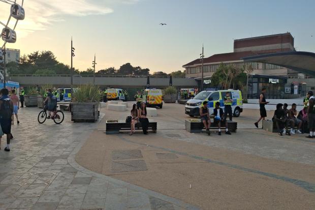 Police attacked with 'glass bottles and other missiles' during beach ...
