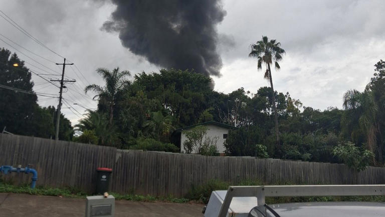 Horror moment tyre shop engulfed in flames