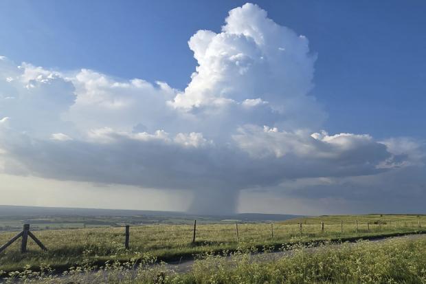 ‘Surreal’ storm breaking over town spotted from Wiltshire landmark amid ...