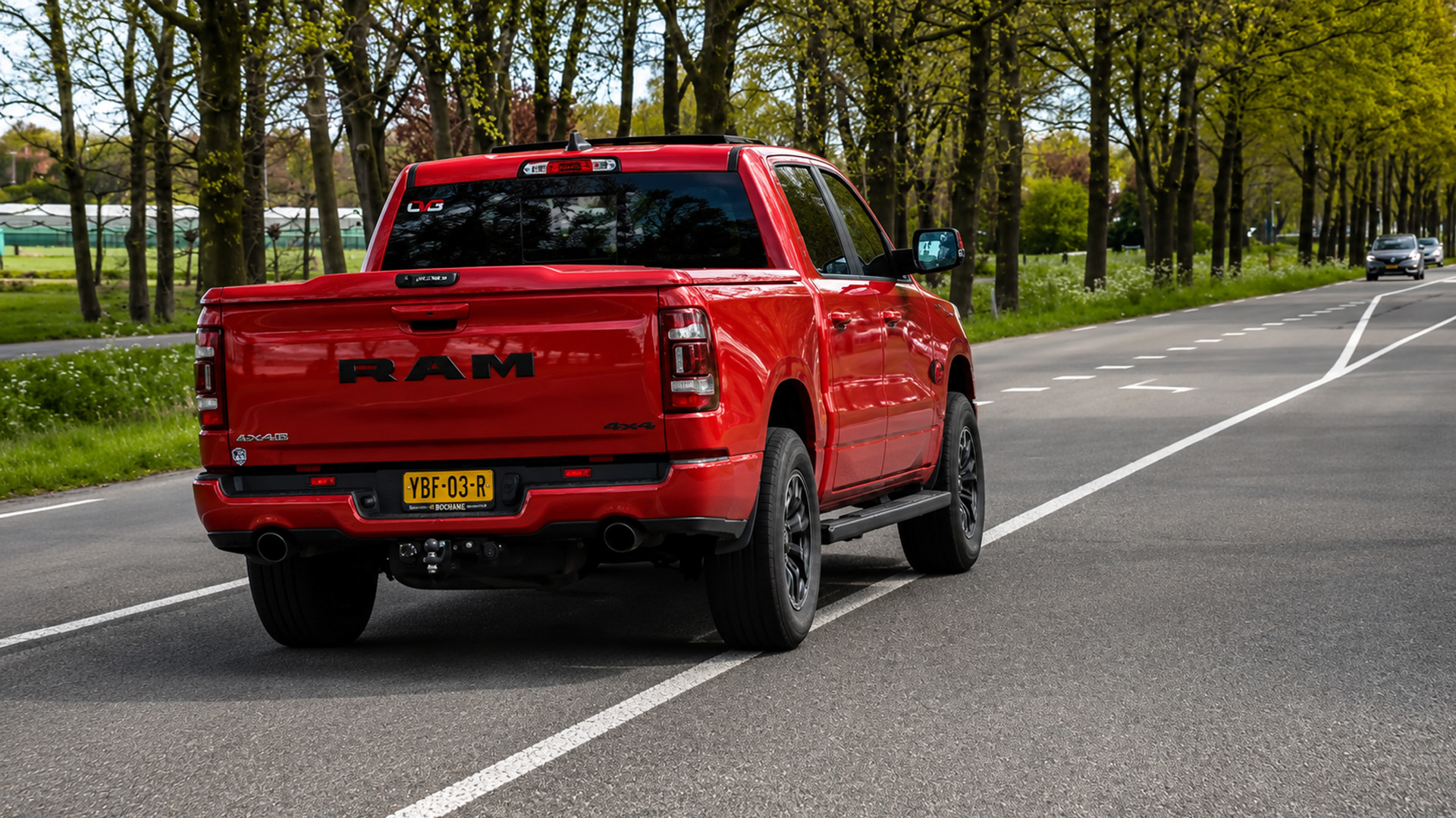 A bold Ram 1500 cruising through the countryside