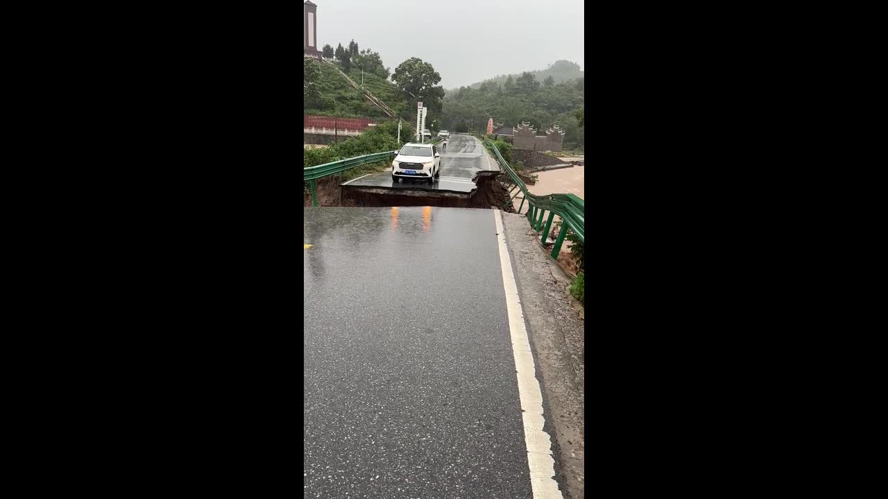 Car plunges into raging river as broken bridge collapses in China